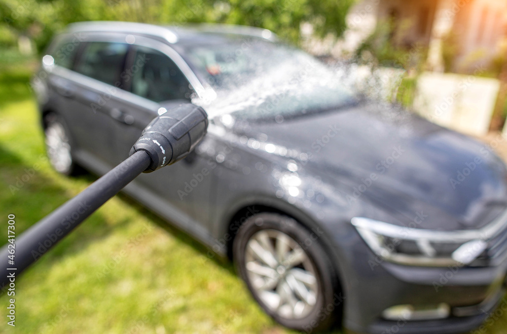 Car wash with modern car shampoo using a high pressure washer in summer ...