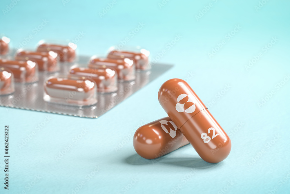 Pills of the drug Molnupiravir in front of a blister package ...