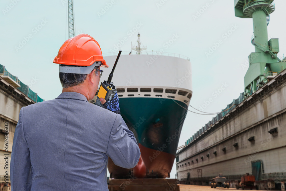 Supervisor hand holding walkie talkie, foreman, inspector, surveyor ...