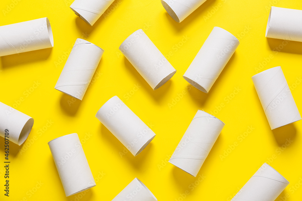 Empty toilet paper tubes on color background Stock Photo | Adobe Stock