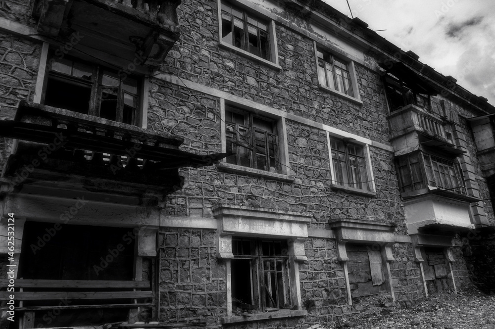 Black and white photo of old abandoned partially collapsed building ...