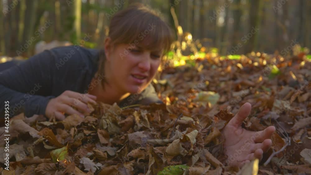 SLOW MOTION, CLOSE UP, DOF: Caucasian woman holds her injured wrist ...