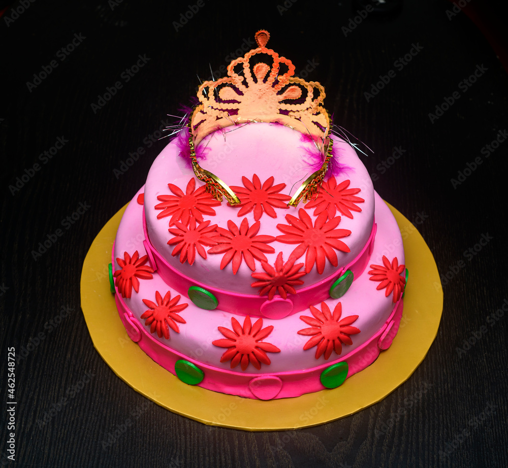 Beautiful home-baked two-tier wedding party cake design with a tiara on ...