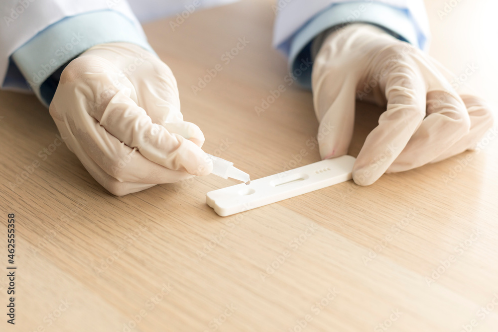 Medical worker doctor holding swab sample collection kit, performing ...