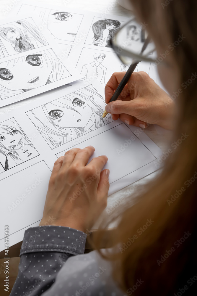 An artist draws a storyboard of an anime comics book. Manga style ...