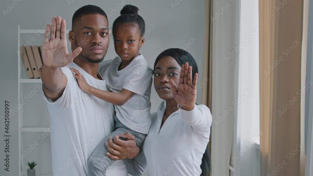 African family black serious young afro parents with little daughter ...