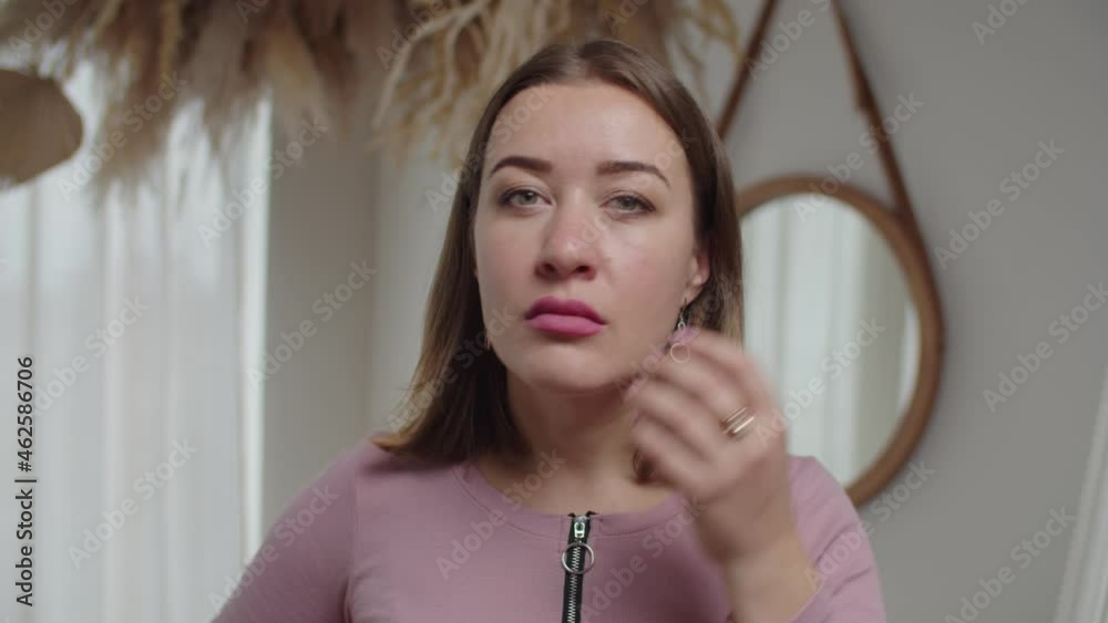 Video Stock Beauty portrait of charming worried adult female looking at ...