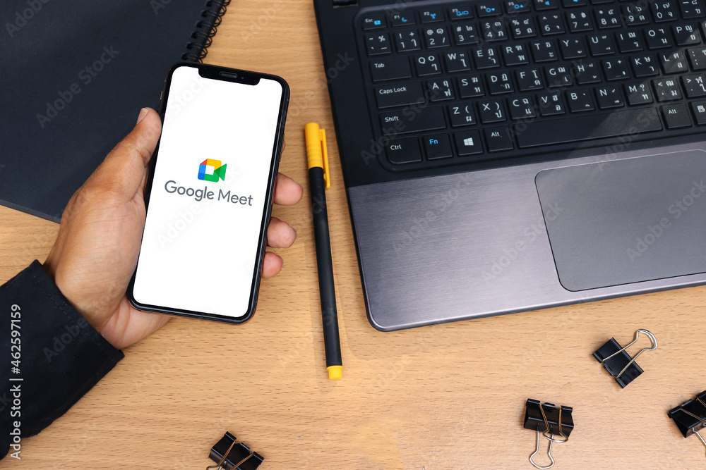 Google Meet app logo on smartphone screen, desk background - Chiang Mai ...