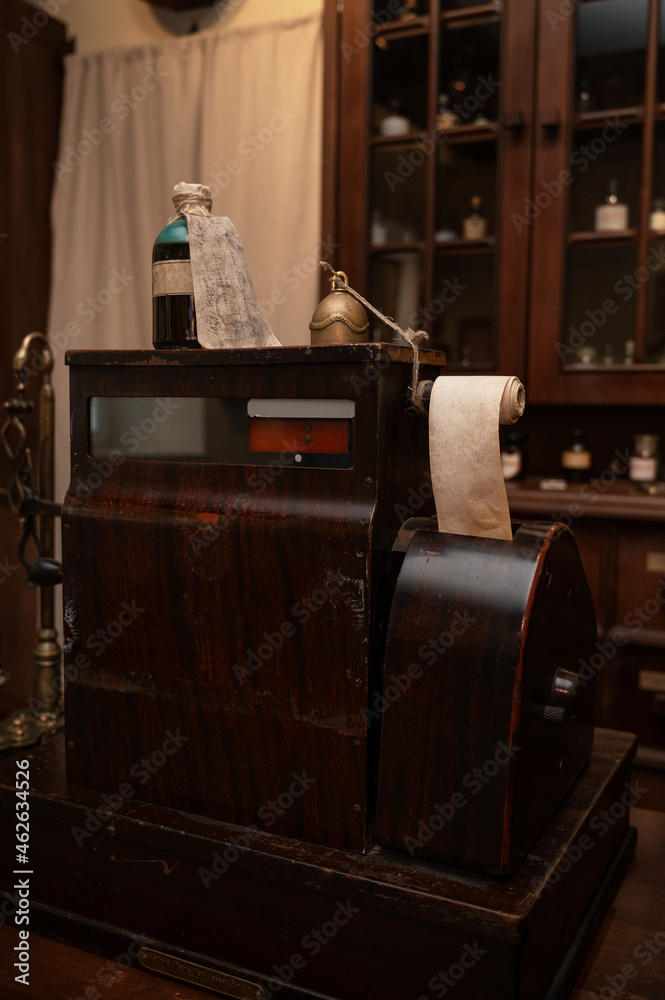 Vintage cash register in old pharmacy. Wooden antique furniture for ...