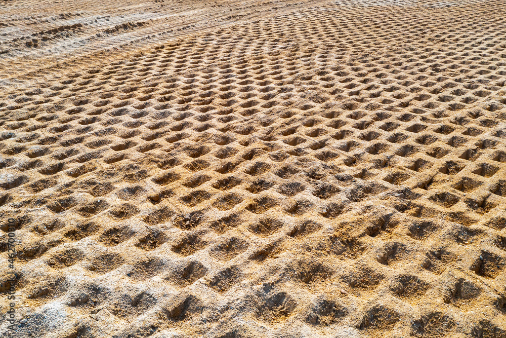 Compaction of soil at the construction site, compaction of soil before ...