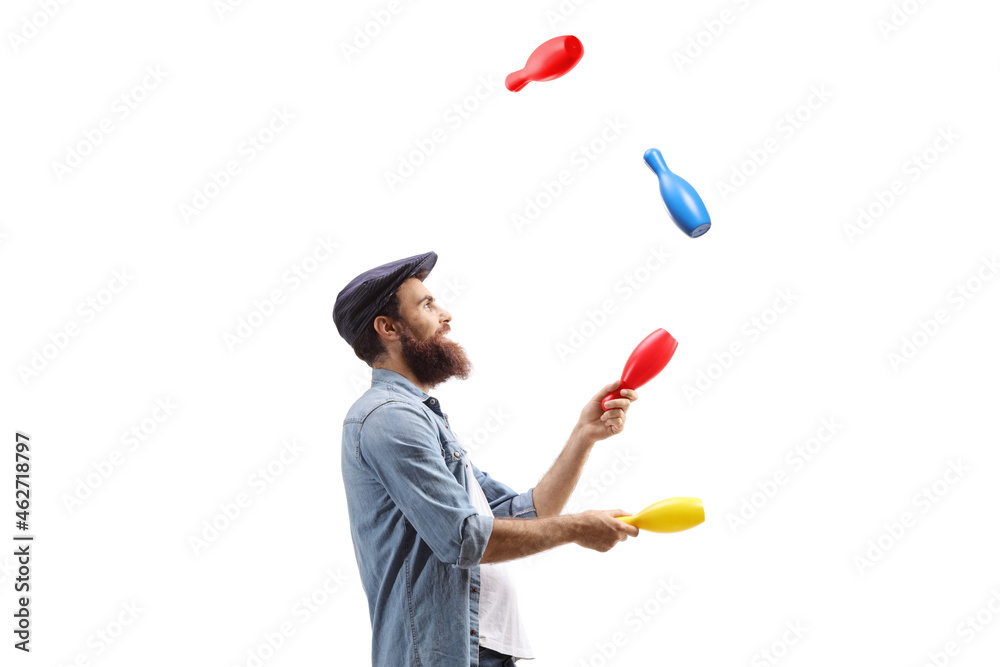 Profile shot of a juggler juggling with clubs Stock Photo | Adobe Stock
