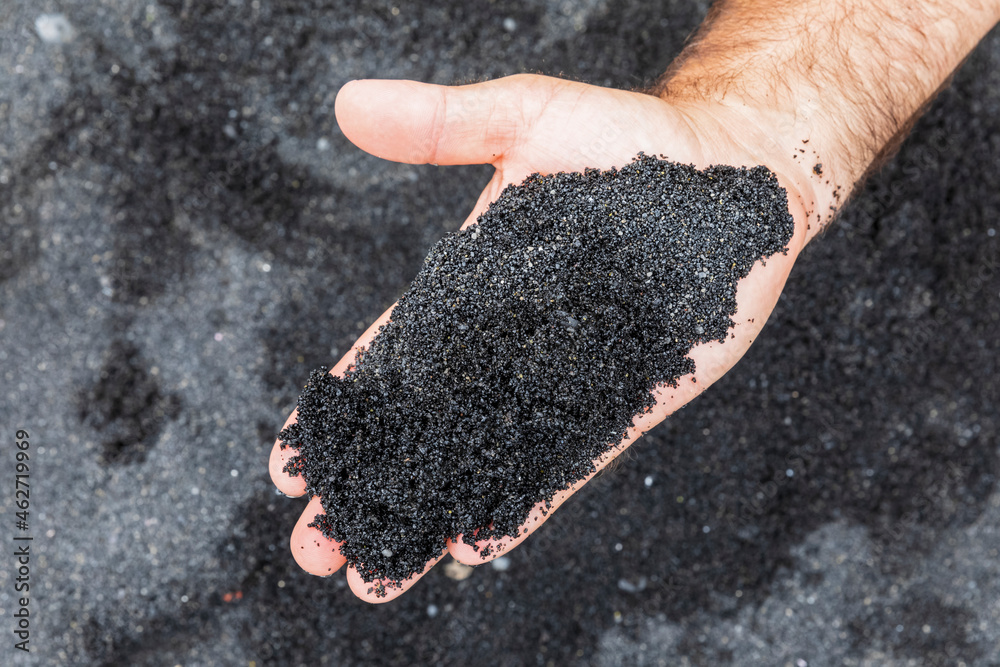 USA, Hawaii, Big Island, Hand holding black lava sand Stock Photo ...