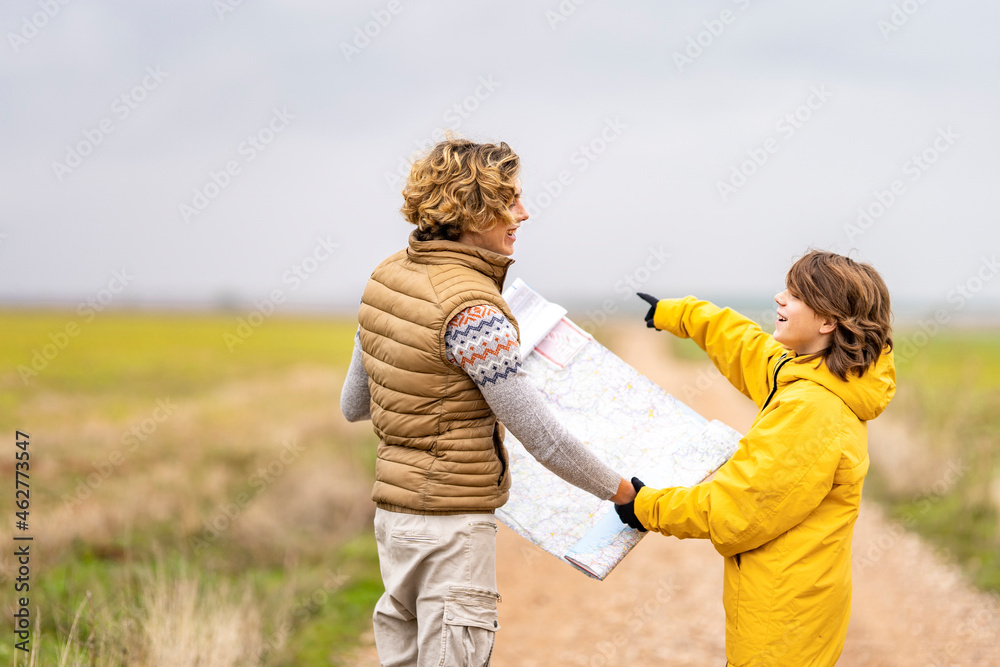 Two brothers checking map during hike Stock Photo | Adobe Stock