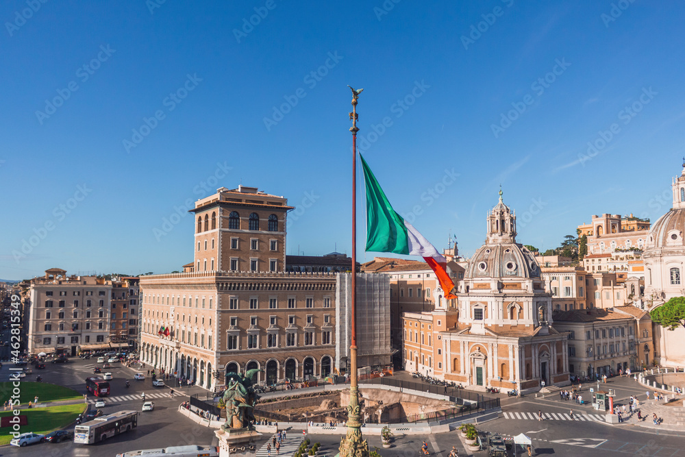 Italy, Rome, Italian flag fluttering against Palazzo Bonaparte and ...