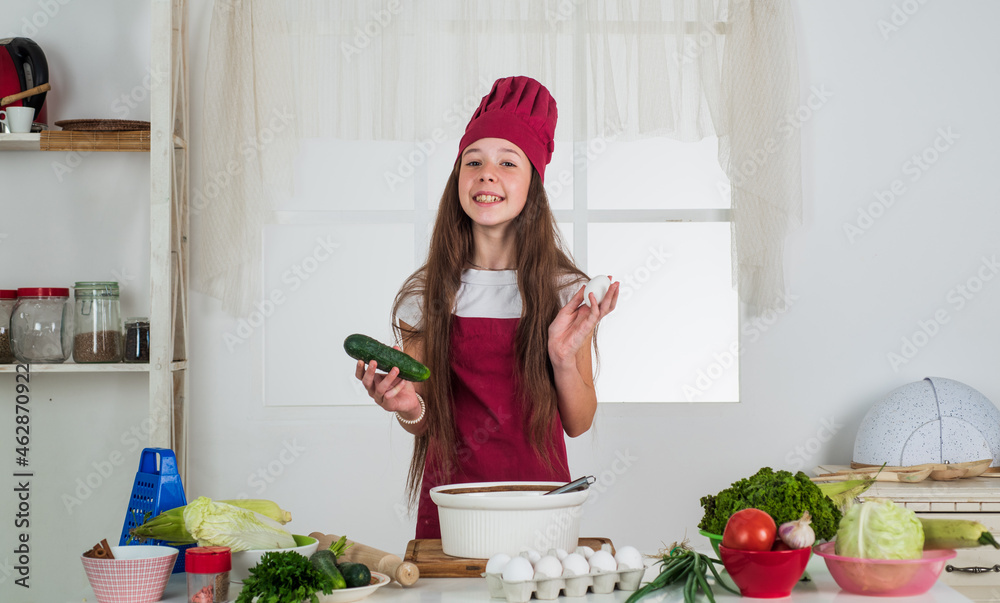 Food in your budget. kid chef cooking with cucumber and egg. child ...