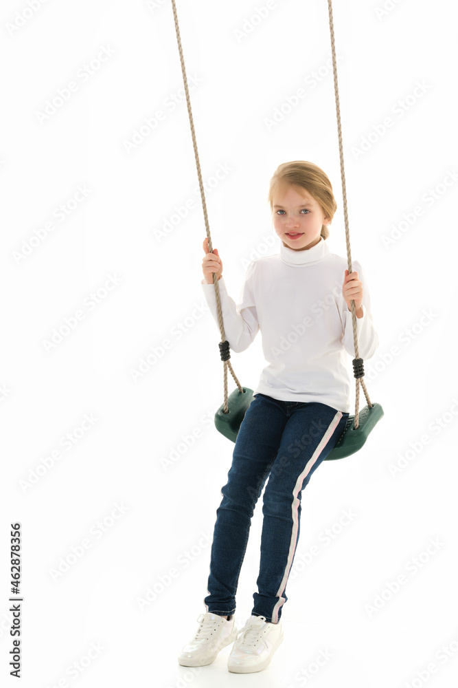 Beautiful teen school girl swinging on a swing. Concept summer vacation ...