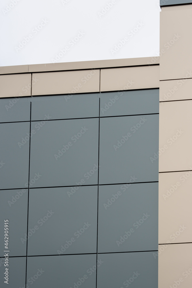 The exterior wall of a contemporary commercial style building with ...