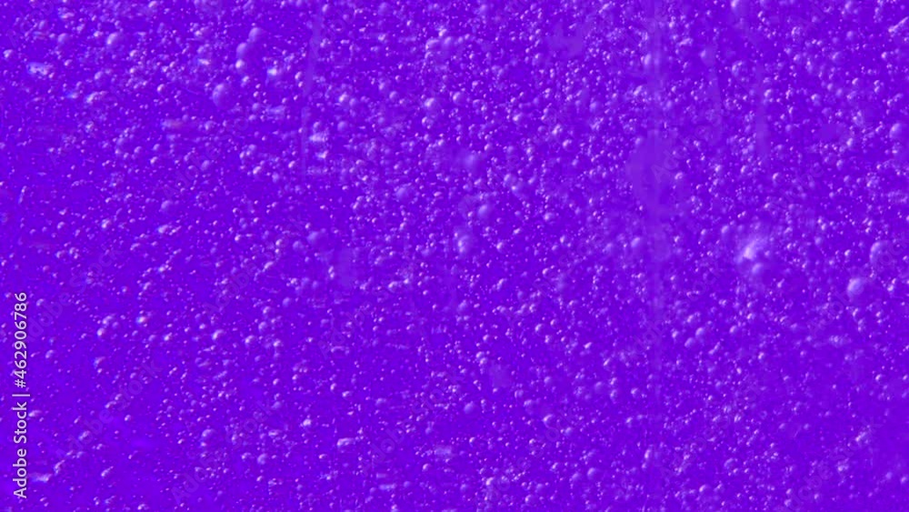 Slow motion of air bubbles inside transparent bottle of cleaning agent ...