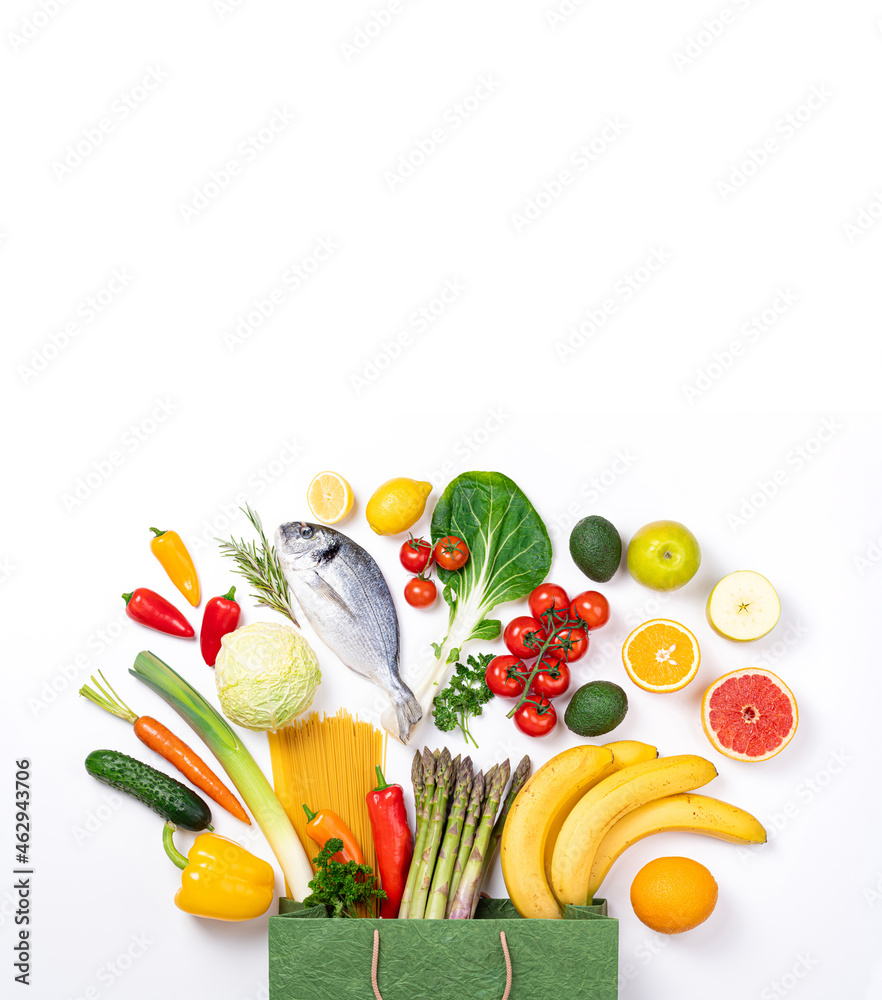 Healthy food background. Healthy food in paper bag fish, vegetables and ...