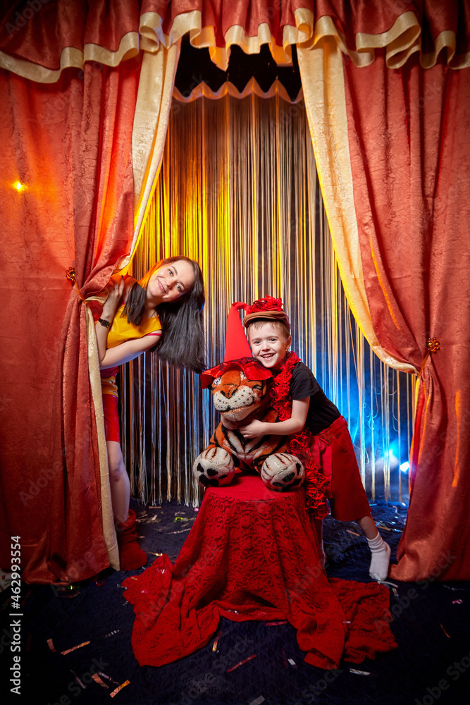 Family during a stylized theatrical circus photo shoot in a beautiful ...
