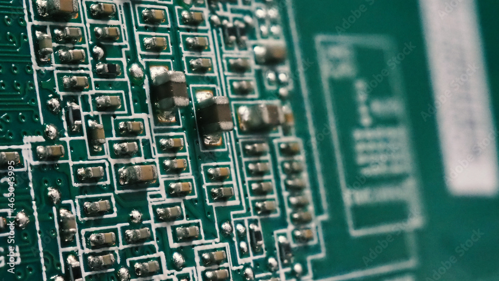 Semiconductor. cpu chip located on the green motherboard of the ...