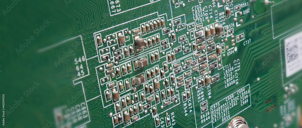 Semiconductor. cpu chip located on the green motherboard of the ...