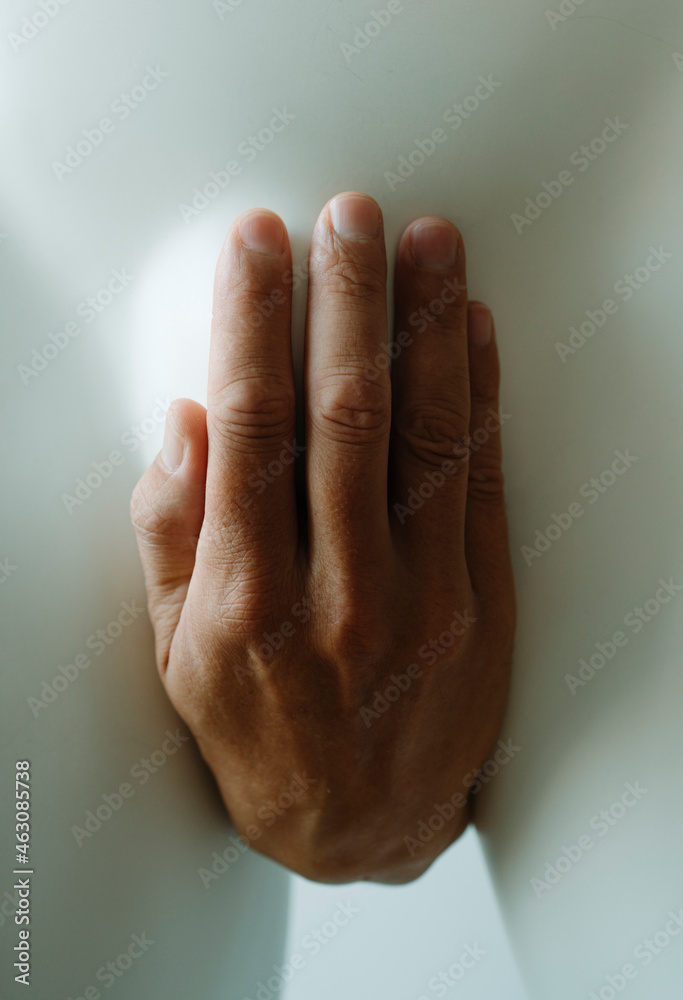 man covering the mannequins crotch Stock Photo | Adobe Stock