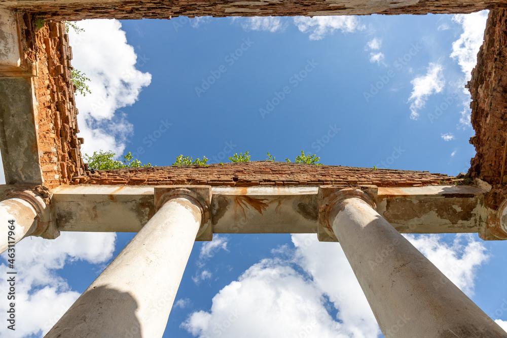 crumbling columns of a century-old palace against a blue sky Stock ...