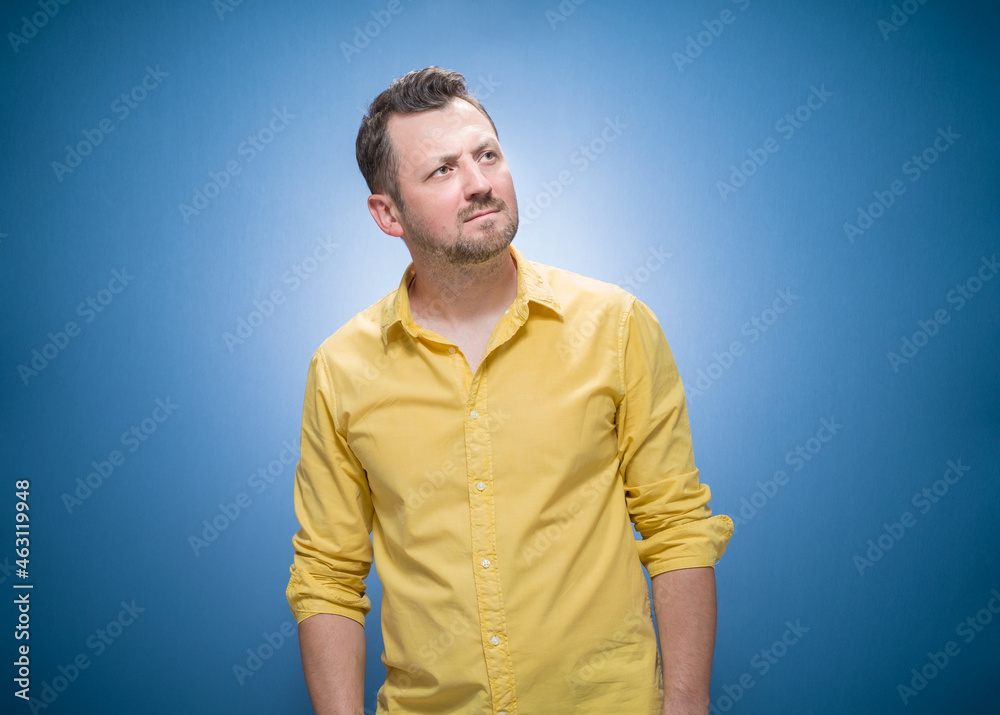 Strict young man thinks. Portrait of doubtful guy with confusion face ...