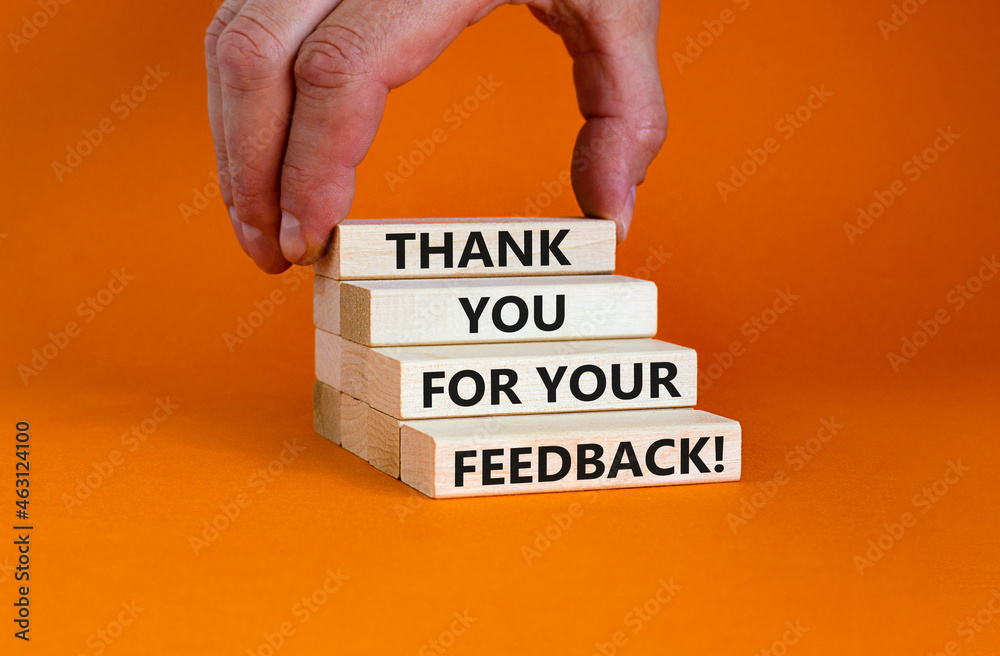 Thank you for your feedback symbol. Wooden blocks with concept words ...