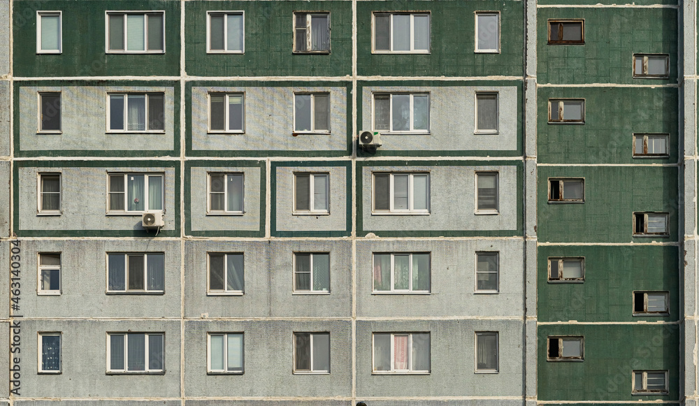 Windows and balconies of the residential building. Old urban obsolete ...