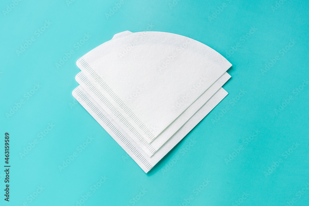 Bleached paper coffee filter isolated on light blue background ...
