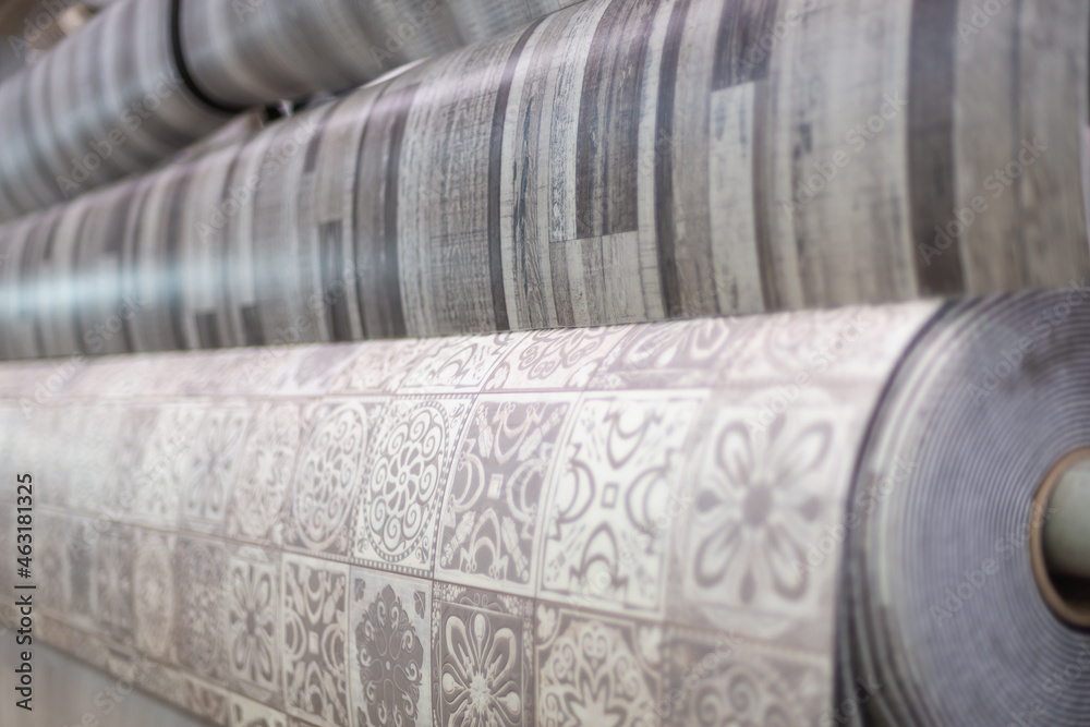 Linoleum of different colors in rolls in a construction store. Stock ...