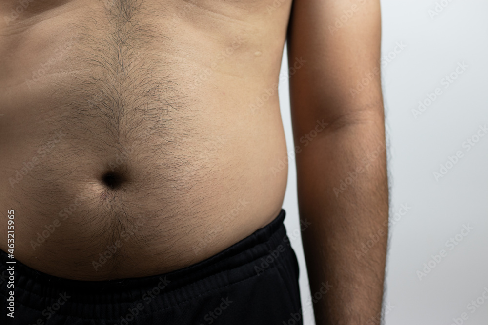 A front-side photo of a shirtless man with a rather fat, bulging body ...