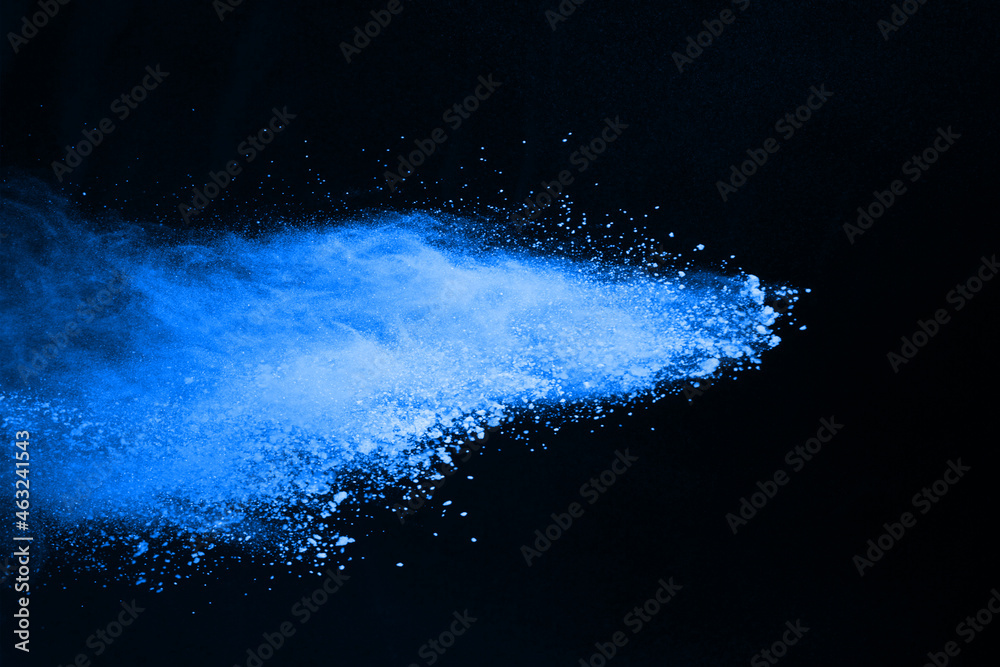 abstract blue powder splatted background,Freeze motion of color powder ...
