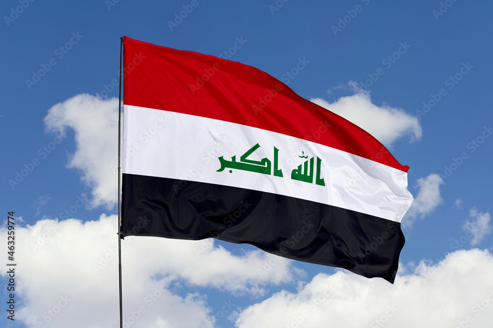 Iraq flag isolated on the blue sky background. close up waving flag of ...