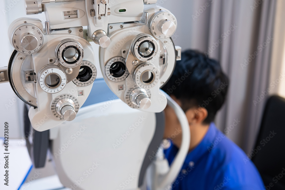 Selective focus at Optometrist face. While doctor using medical ...