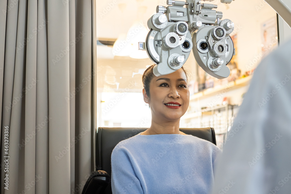Selective focus at Optometrist face. While doctor using medical ...
