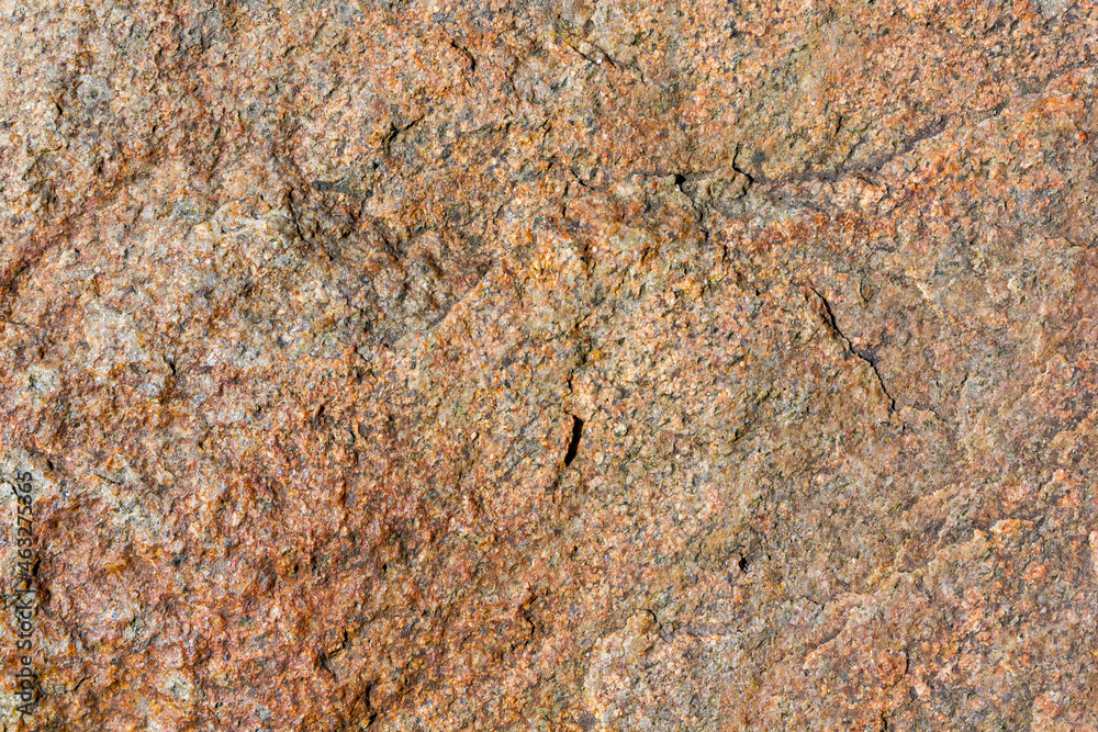 Natural stone texture. Granite surface of sheer cliff. Solid rock close ...