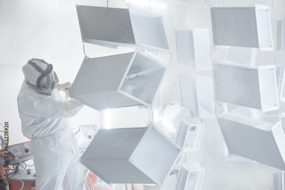 Metalwork workpiece factory paint air spray. Powder coating of metal ...