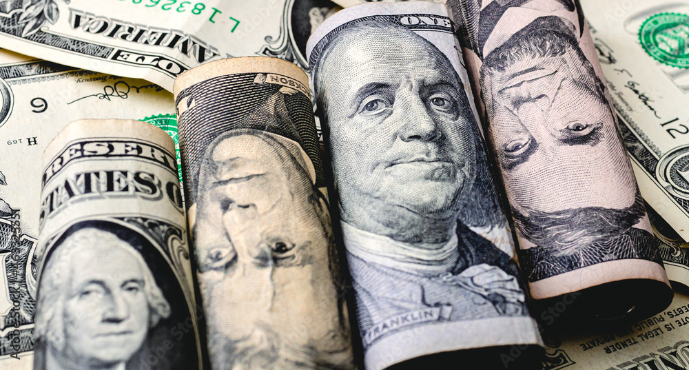 Dollar - USD. Money background with dollar banknotes rolled up in photo ...