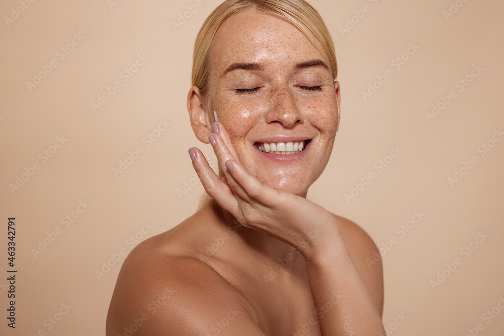 Happy woman with natural beauty skin. Smiling female touching face ...