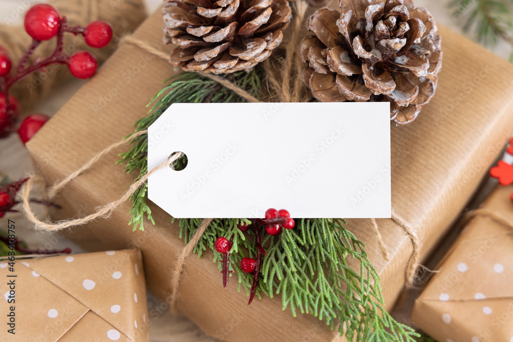 Christmas present with blank gift tag and decorations, Mockup Stock ...