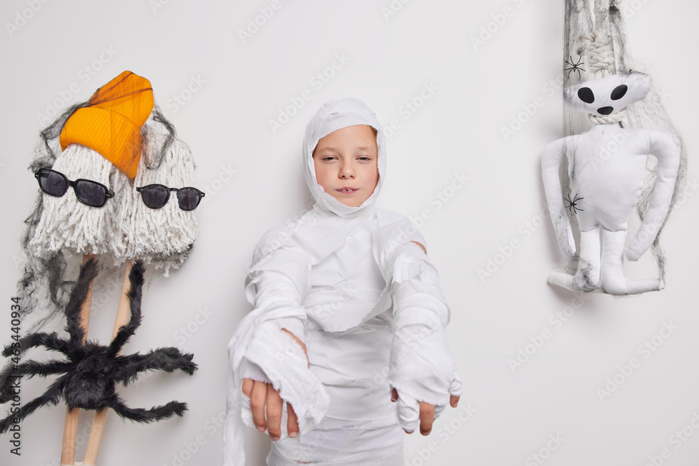 Dangerous small child ghost wears spooky costume poses against white ...