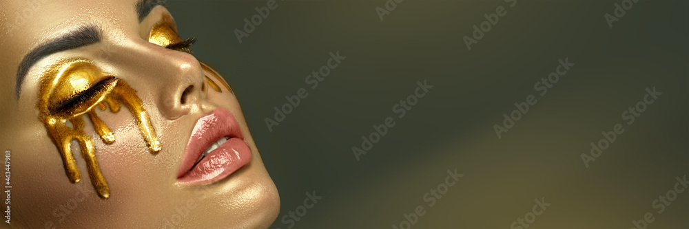Gold Paint smudges drips on the face and eyes, dripping. Sexy lips ...