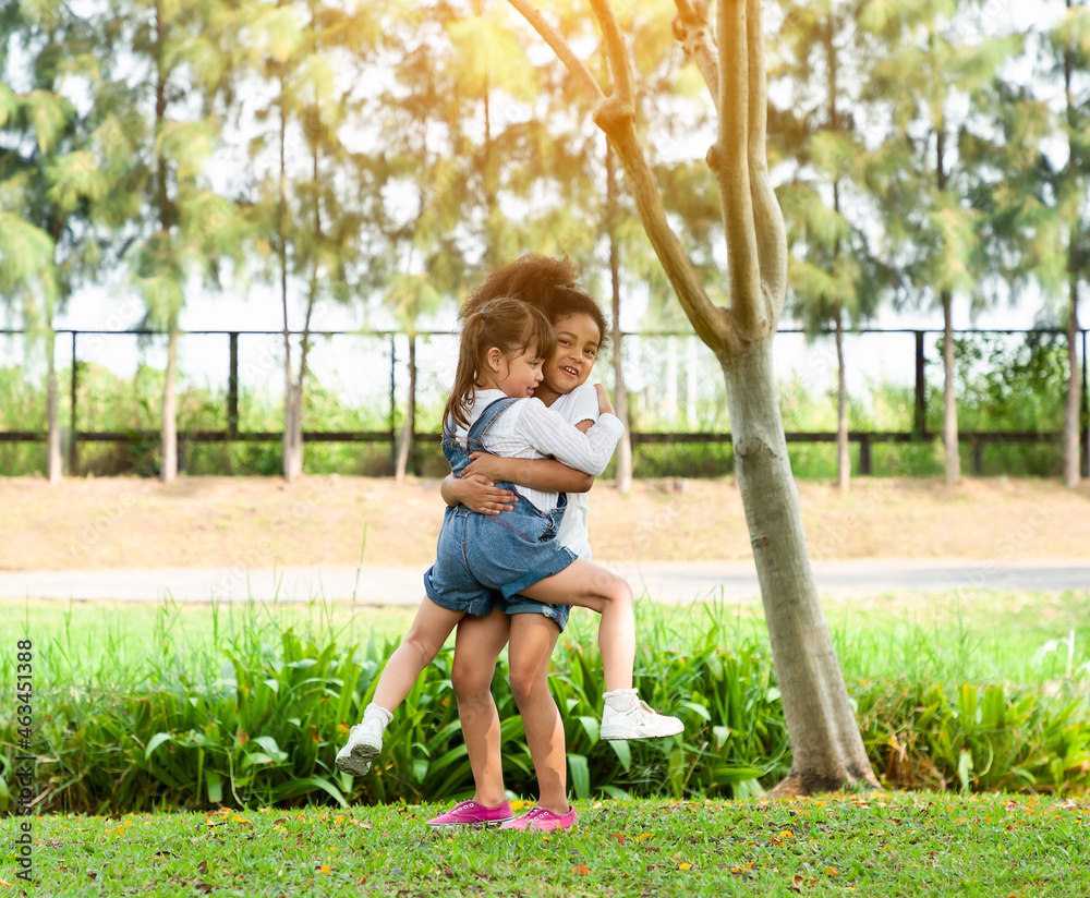 Two Girls Hug Each Other With Love And Playing Together In The Outdoor