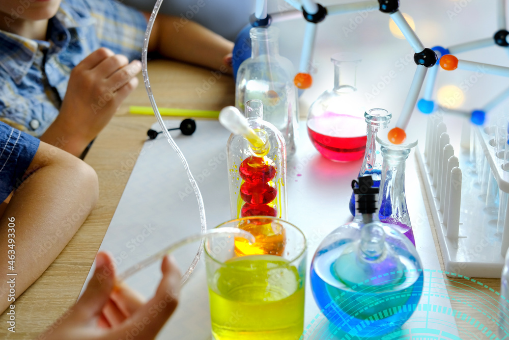 two children 7-9 years old, elementary school boys, do chemical ...