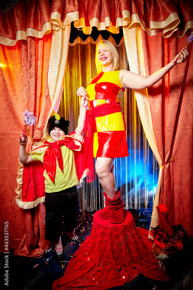 Family during a stylized theatrical circus photo shoot in a beautiful ...
