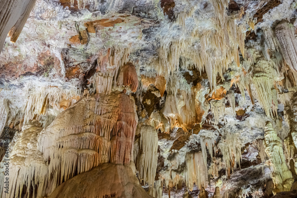 Geologic, Formation of stalactites and stalagmites inside an ancient ...