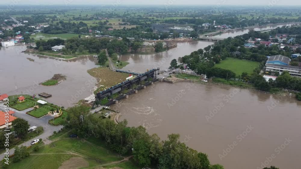 Aerial view of Rama 6 Dam (Phra Narai Gate) with powerful of water ...